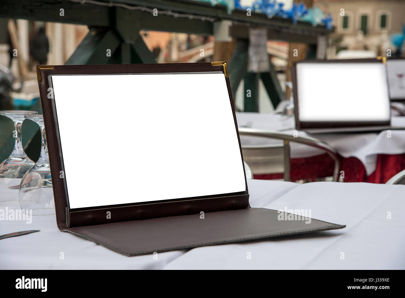 Menu open on a table of a restaurant for your copyspace Stock Photo - Alamy