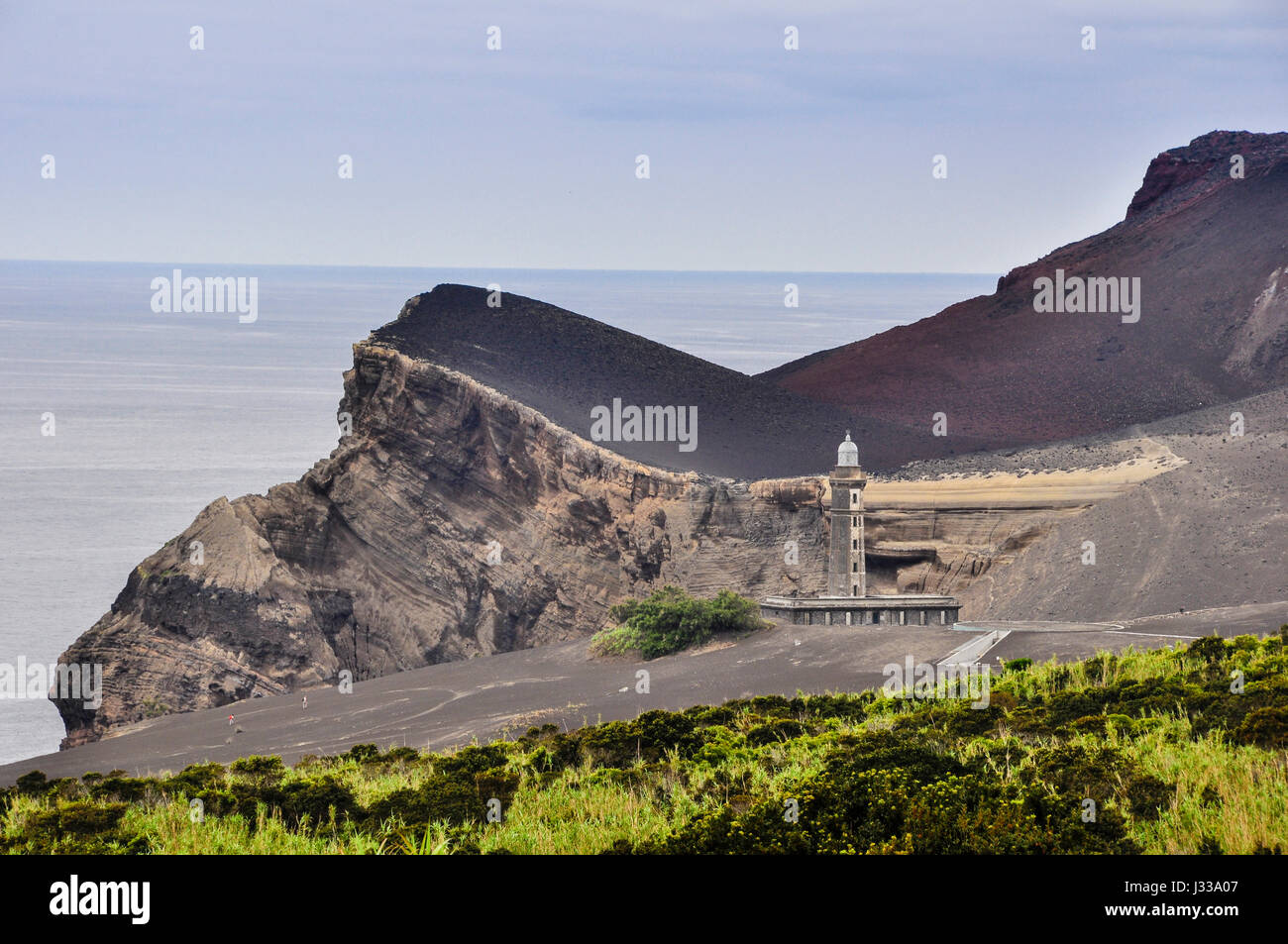 Lighthouse at beach with volcano Vulcao dos Capelinhos, Farol dos ...