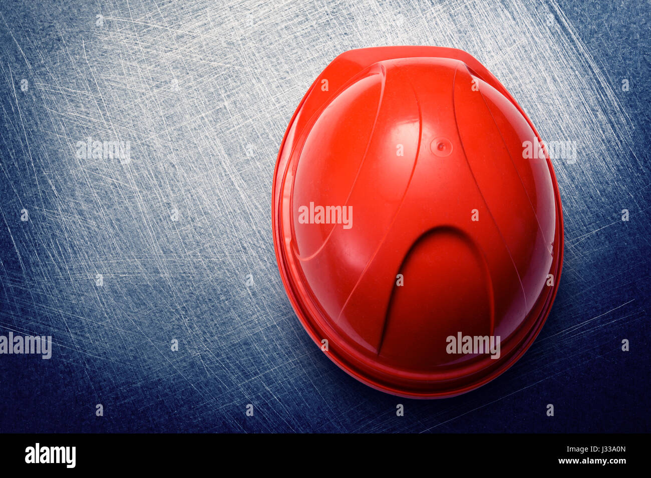 Red safety helmet from the top on met Stock Photo - Alamy