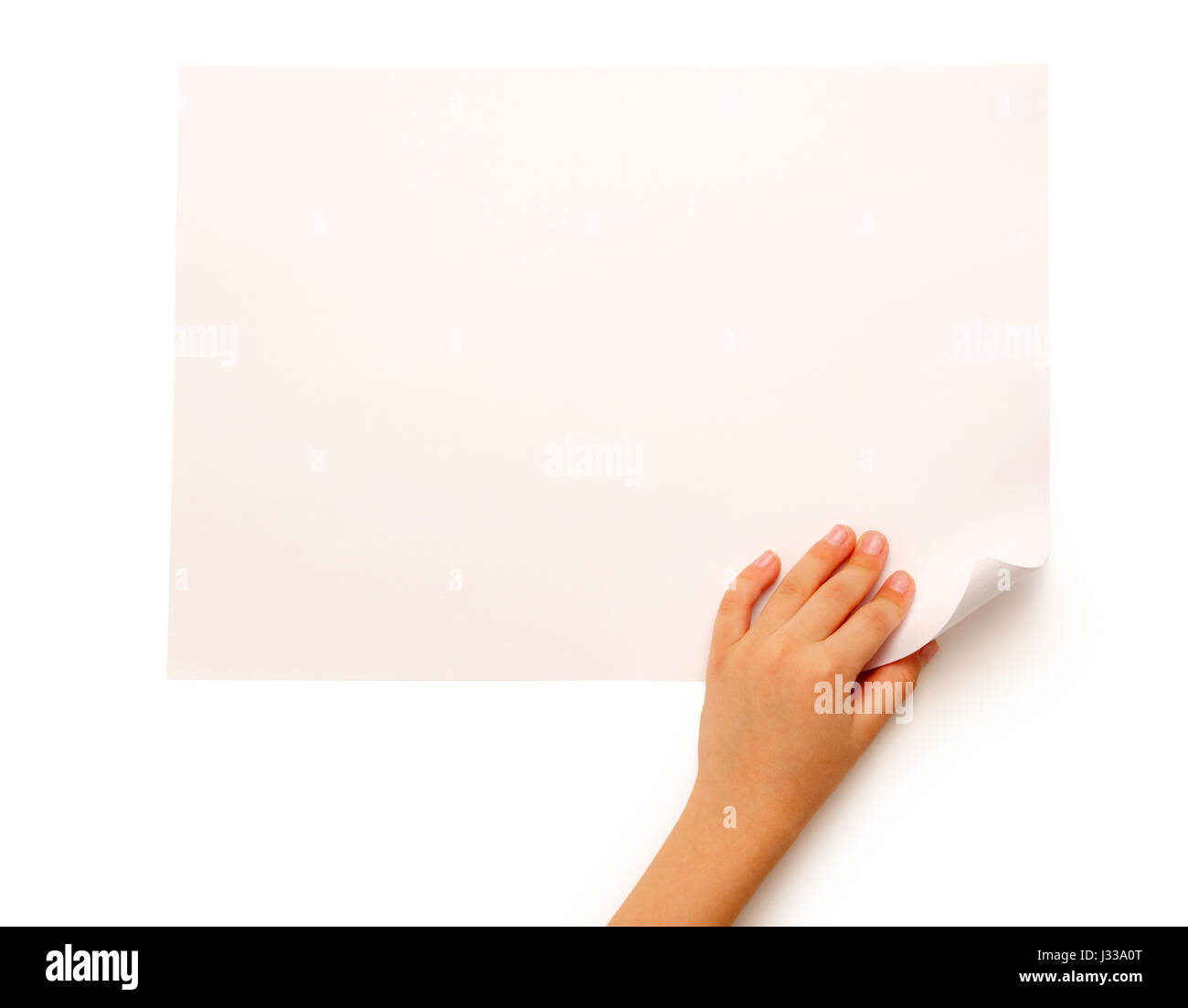 Child's hand turning over sheet of paper Stock Photo - Alamy