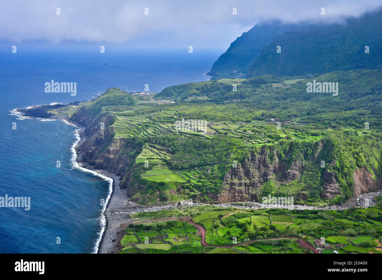 Steep coast with cliffs, terraces and mountains between Faja Grande and ...