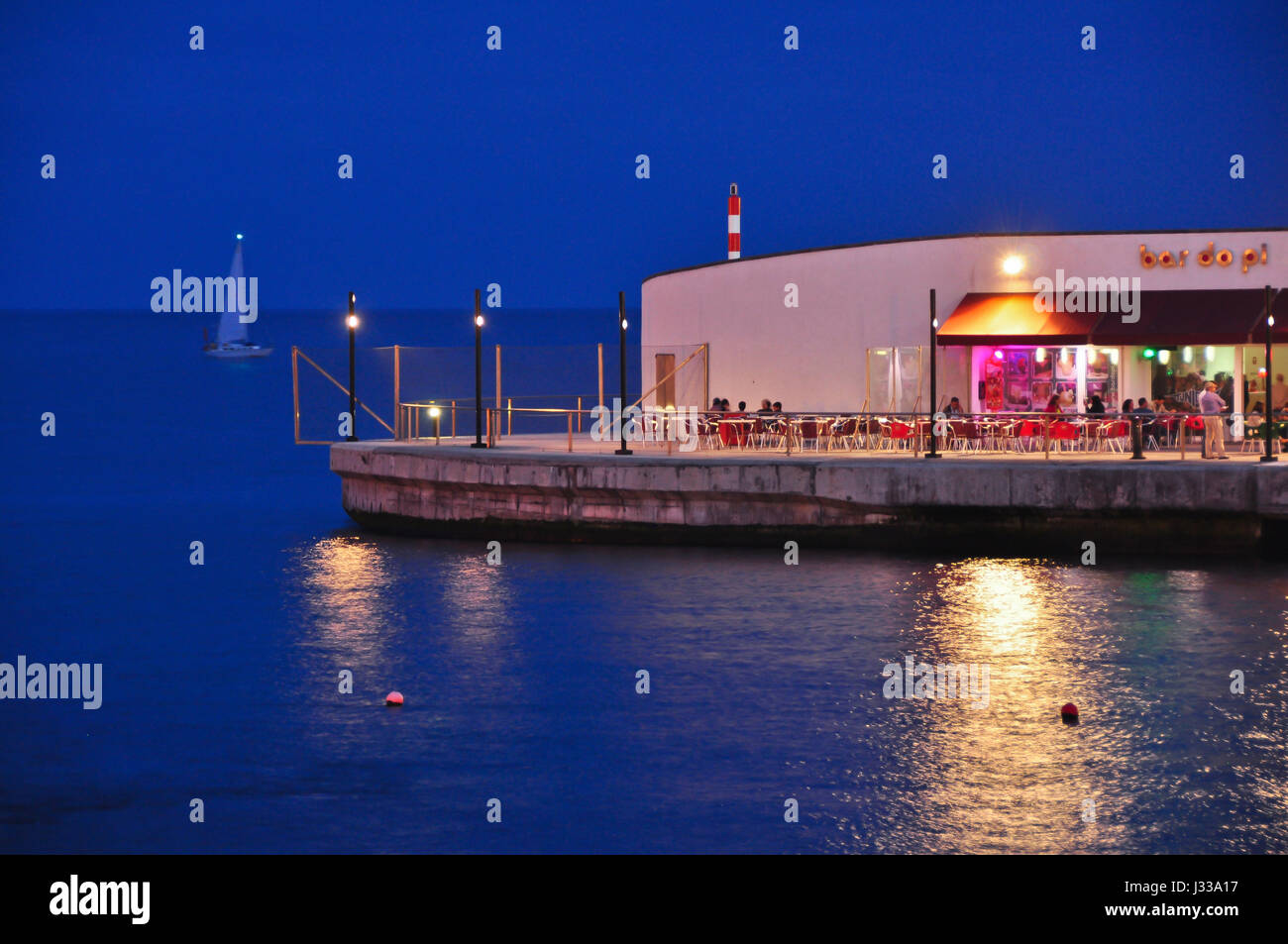 Nightlife in Bar at harbour and pier at evening, capital Ponta Delgada ...