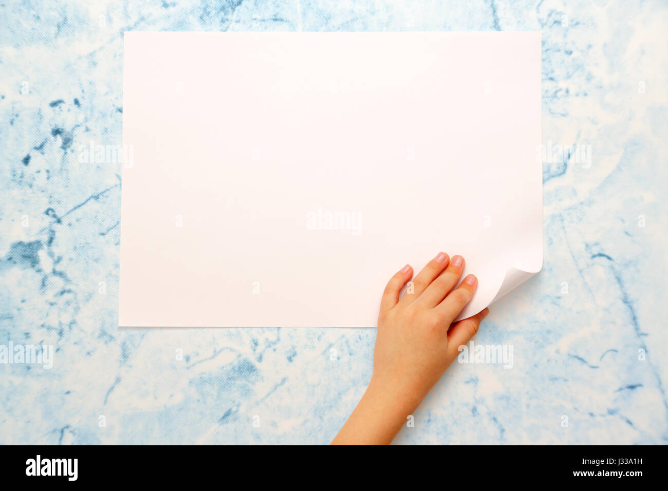 Hand turning page over hi-res stock photography and images - Alamy