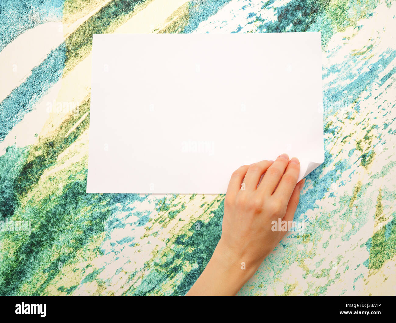 Hand turning page over hi-res stock photography and images - Alamy
