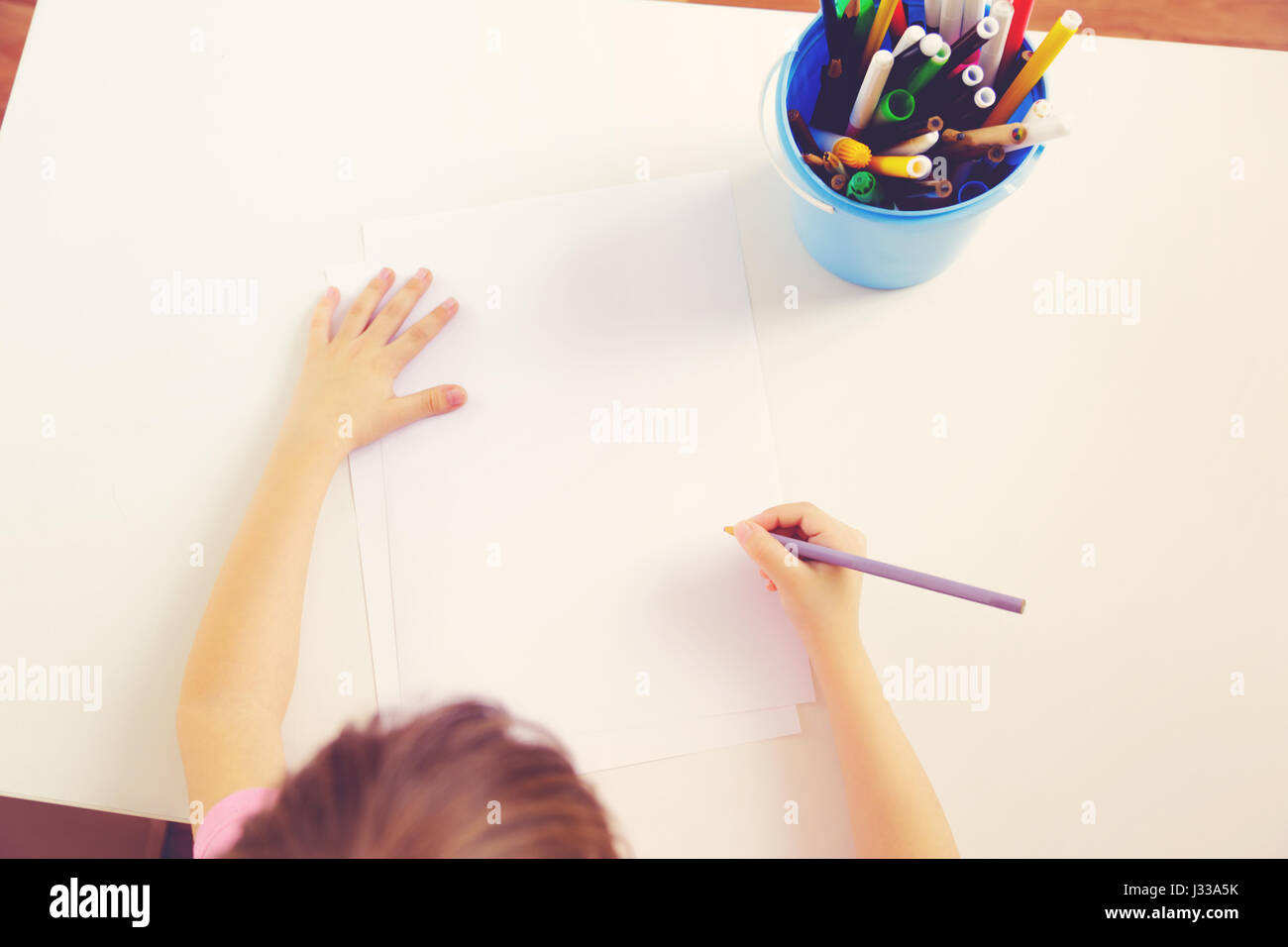 Hand holding crayon coloring hi-res stock photography and images - Alamy