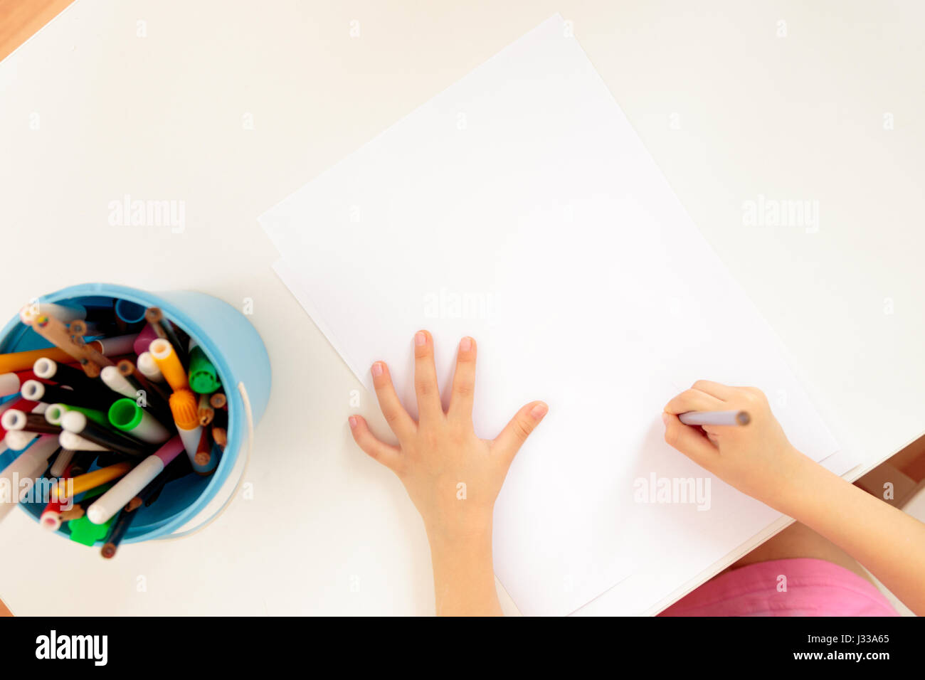 Hand holding crayon coloring hi-res stock photography and images - Alamy