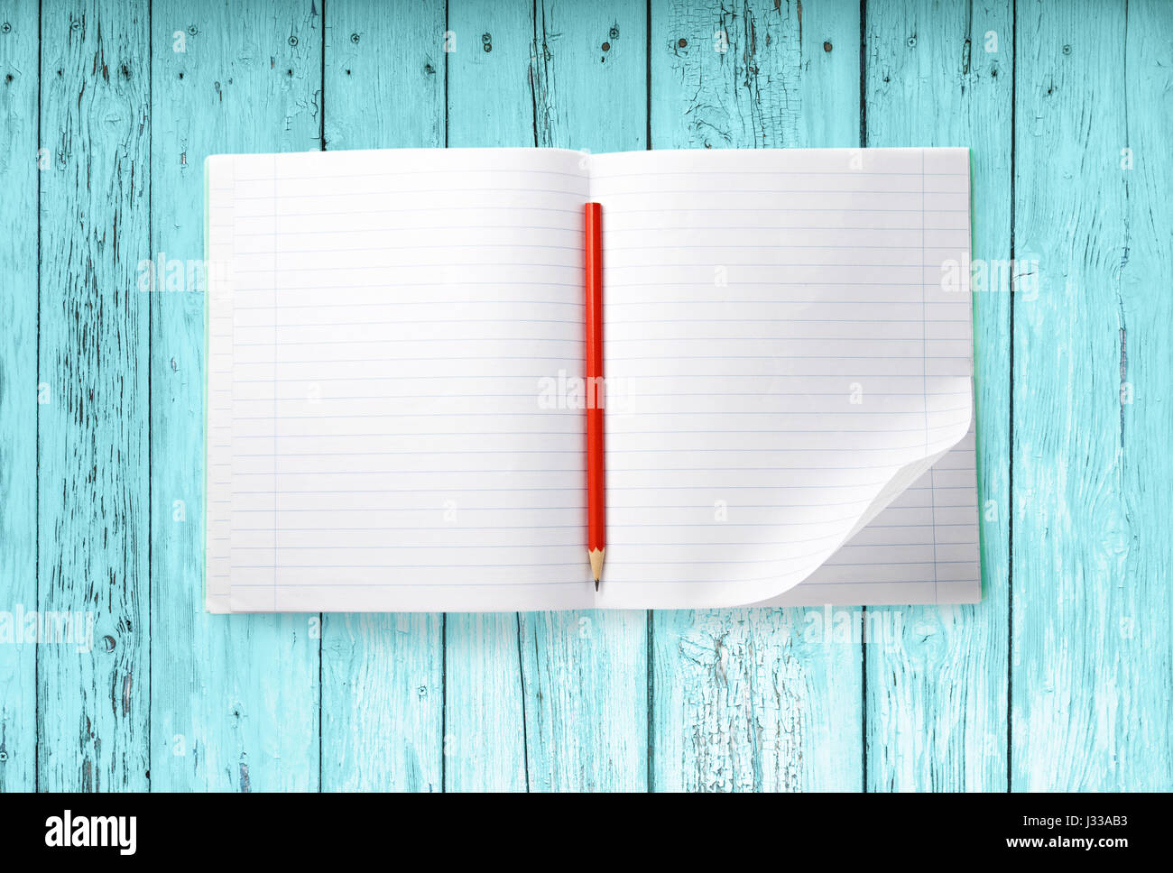 Open blank notebook with red pencil closeup Stock Photo - Alamy