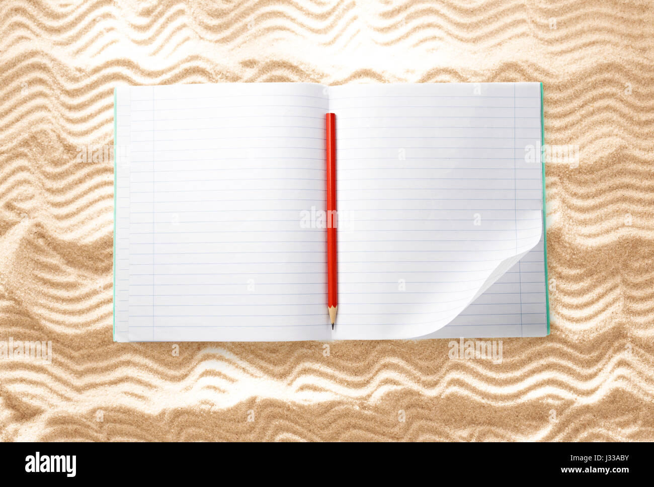 Open blank notebook with red pencil closeup Stock Photo - Alamy