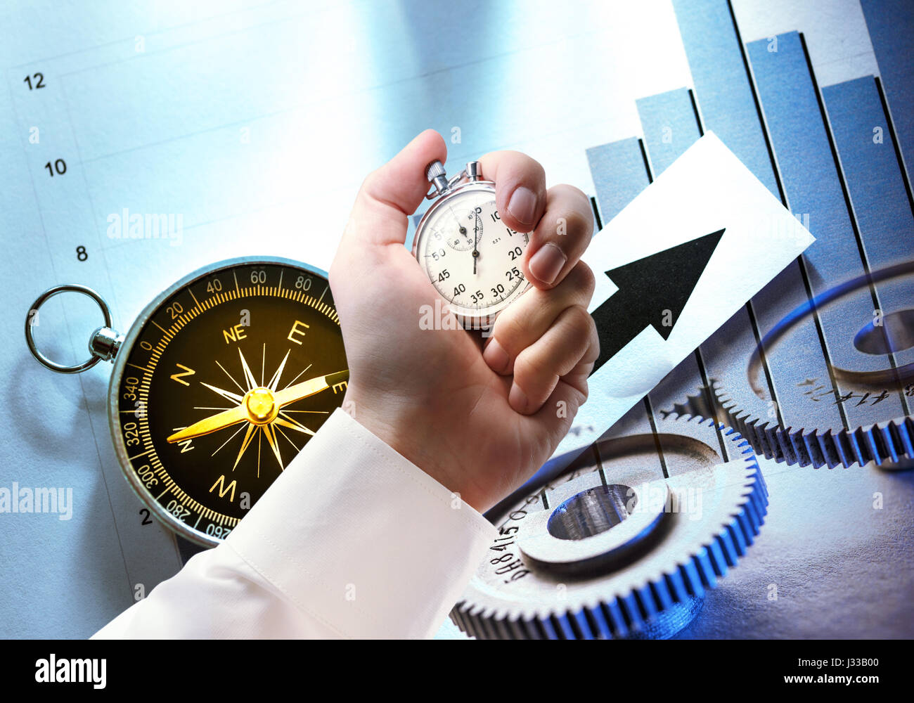 Compass, diagram, cogwheels and stopwatch in male hand Stock Photo - Alamy