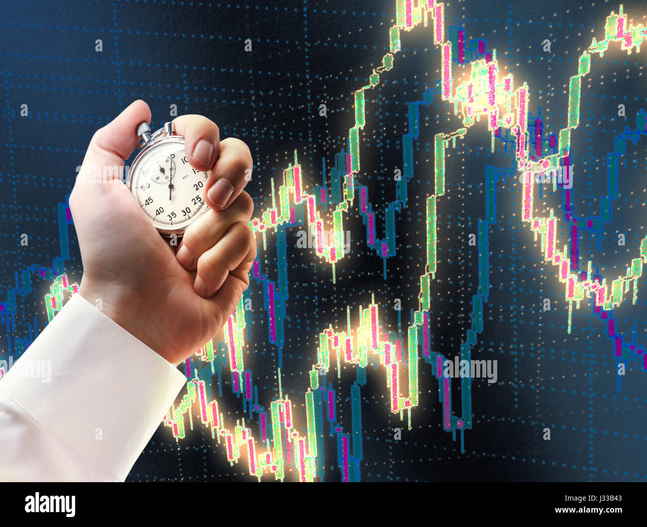 Candlestick chart graphic and stopwatch in male hand Stock Photo - Alamy