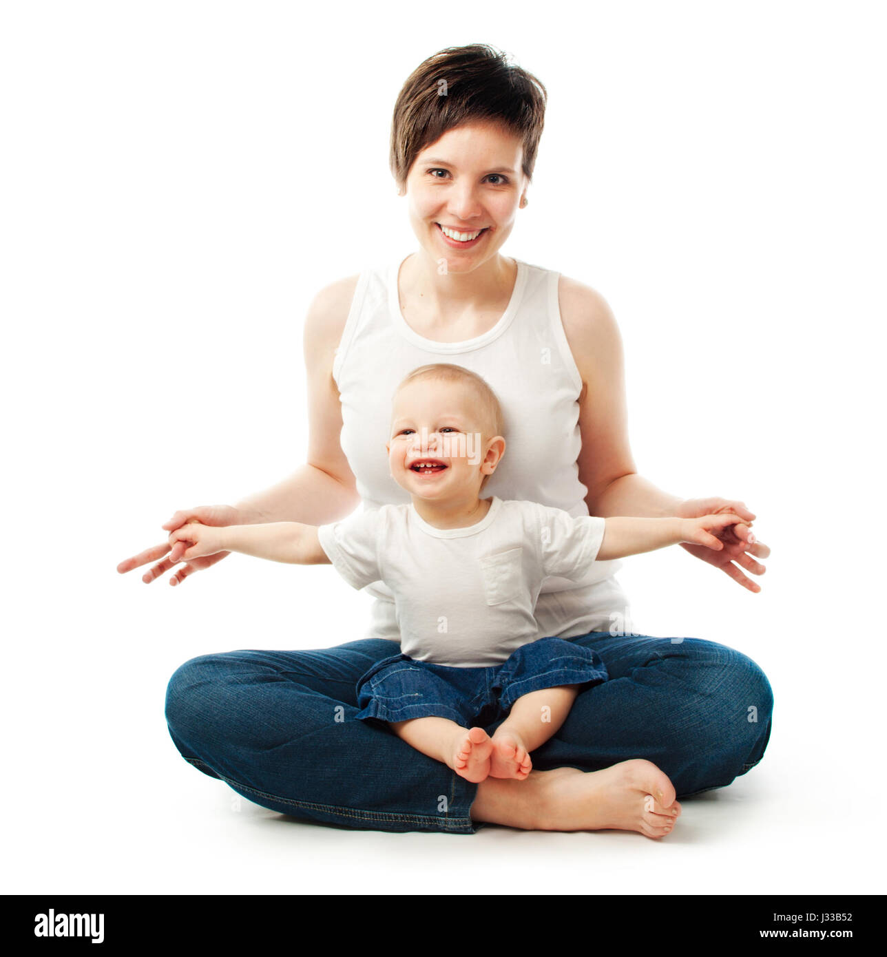 Young mother sitting with her child on white background Stock Photo - Alamy