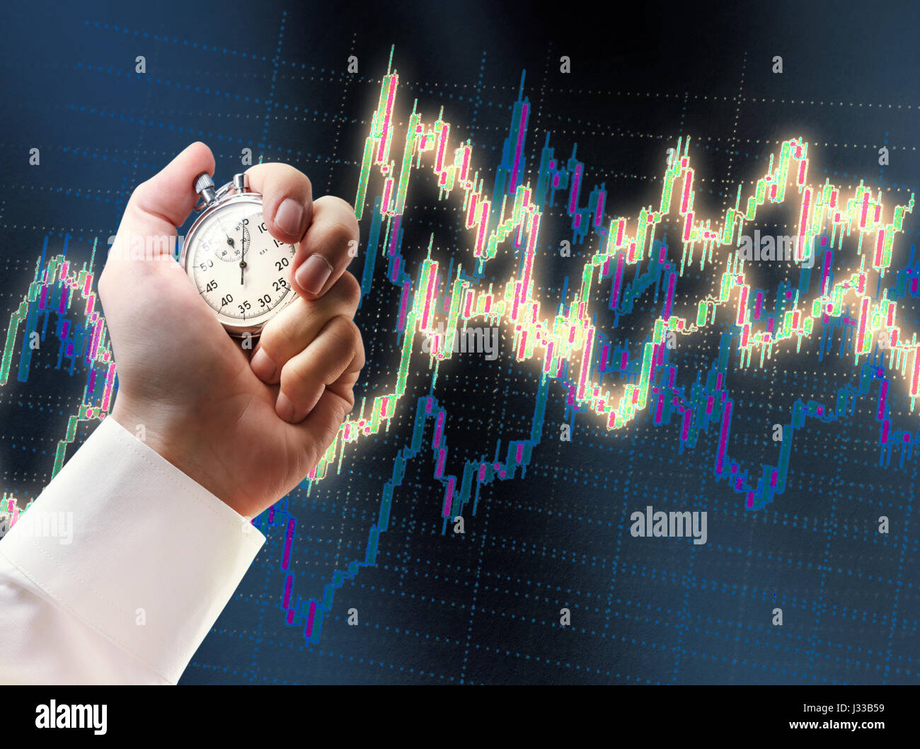 Candlestick chart graphic and stopwatch in male hand Stock Photo - Alamy