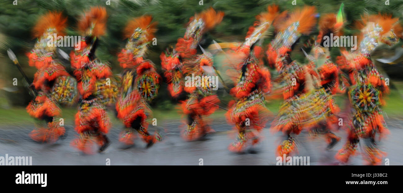 Dancers in motion wearing rtaditional costumes, Atiatihan Festival ...