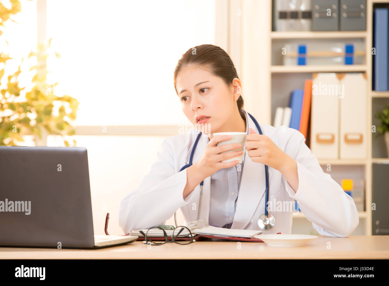 Working long hours in office hi-res stock photography and images - Alamy