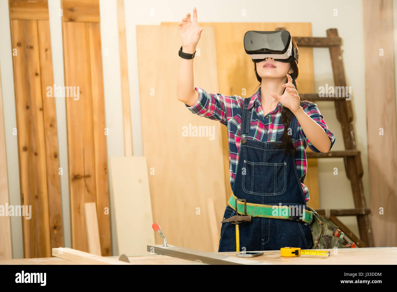 Man doing woodwork in carpentry. Carpenter work on wood plank with vr ...