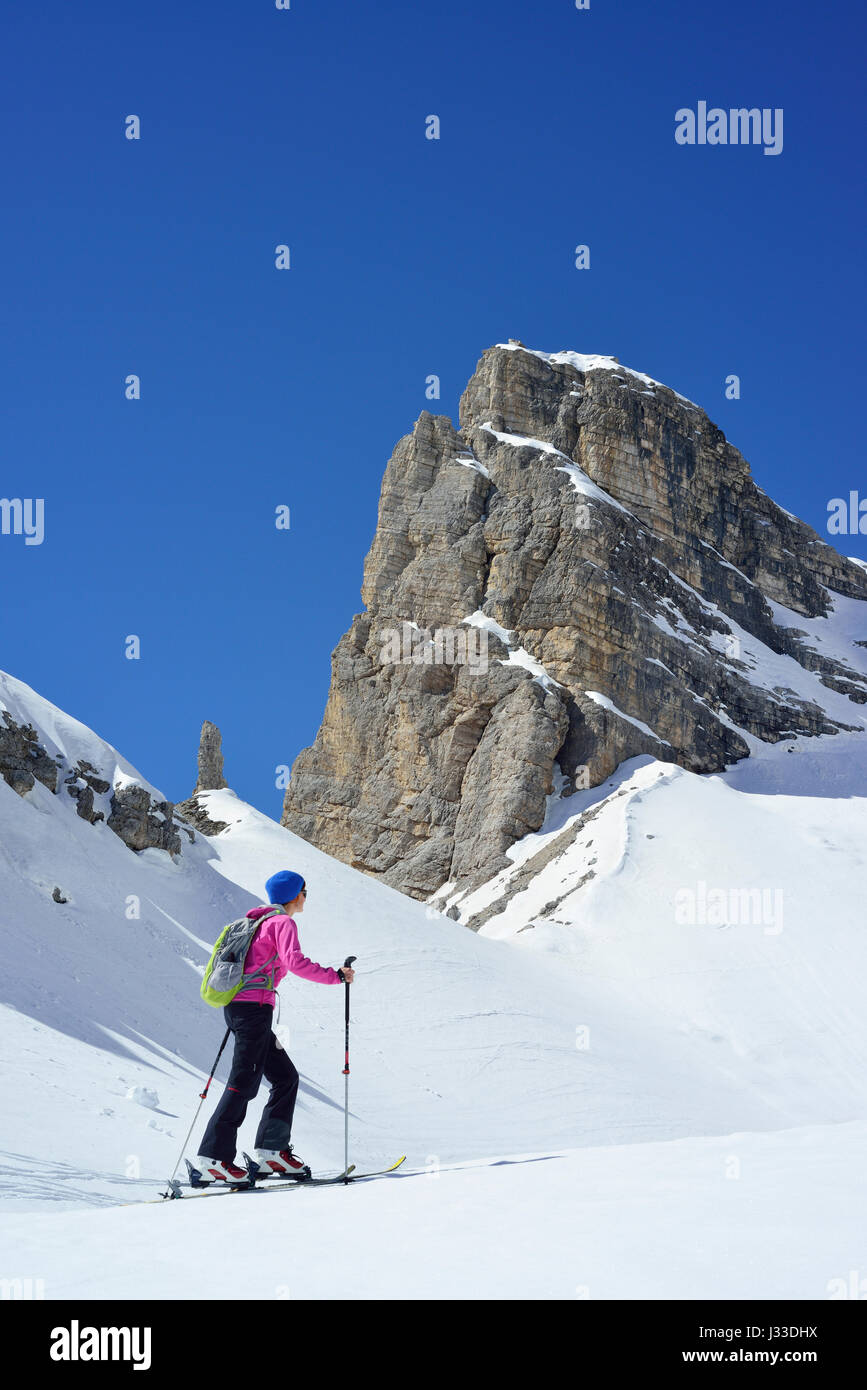 Female back-country skier ascending to Corno d Angolo, Cristallo Group ...