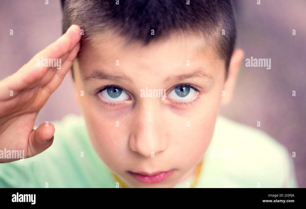 Sad blue eyes boy Stock Photo - Alamy