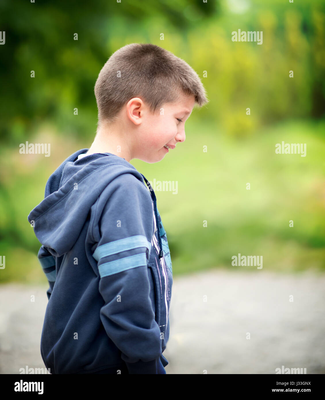 Boy fell on the playground and began to cry Stock Photo - Alamy