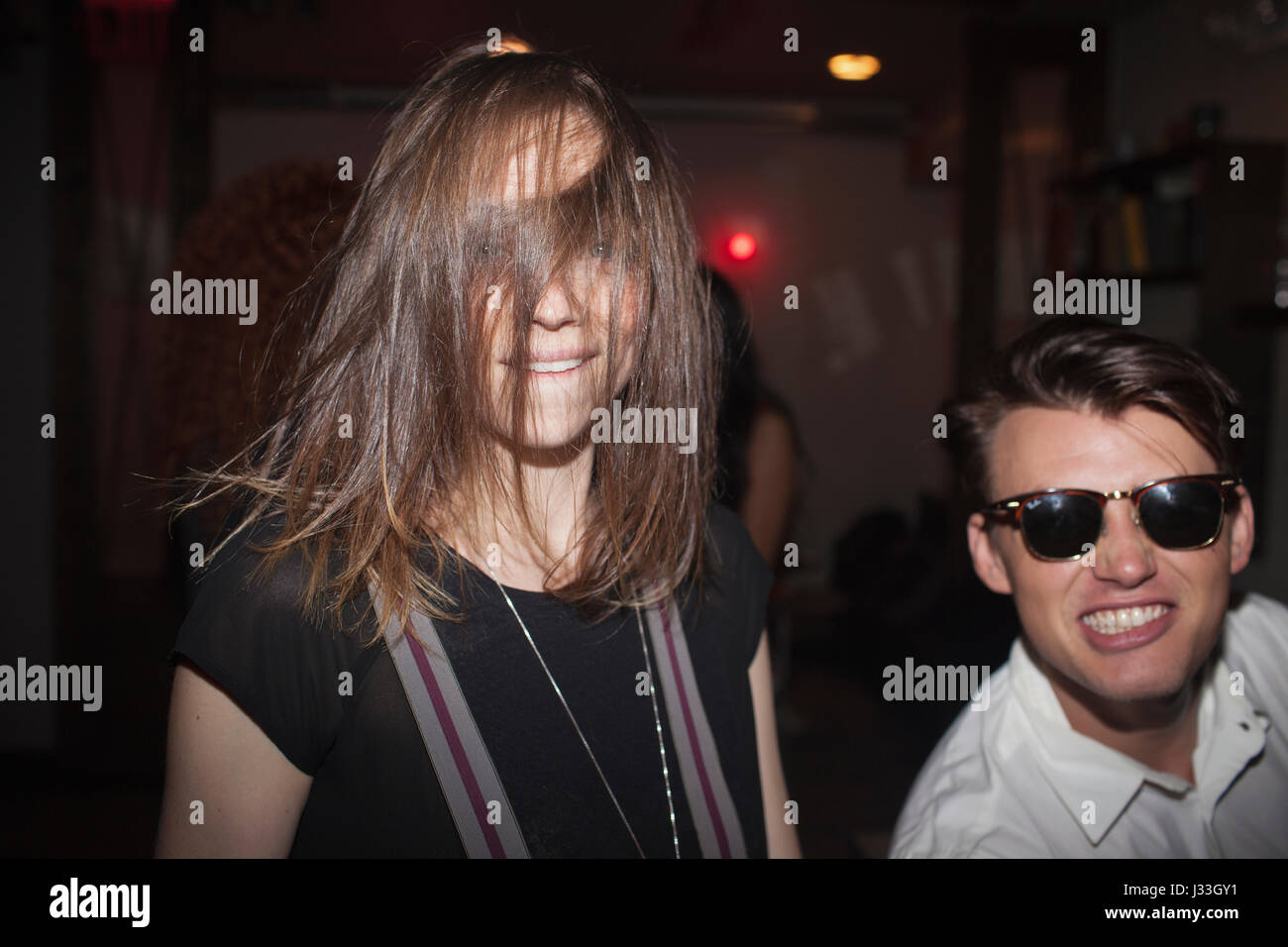 Friends hanging out at a nightclub Stock Photo - Alamy
