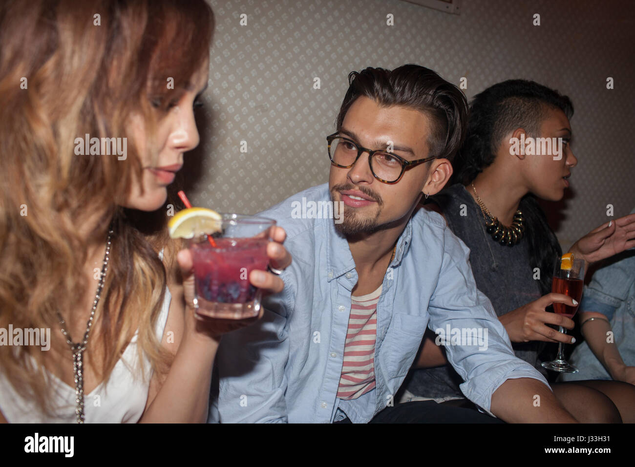 Friends hanging out at a party Stock Photo - Alamy