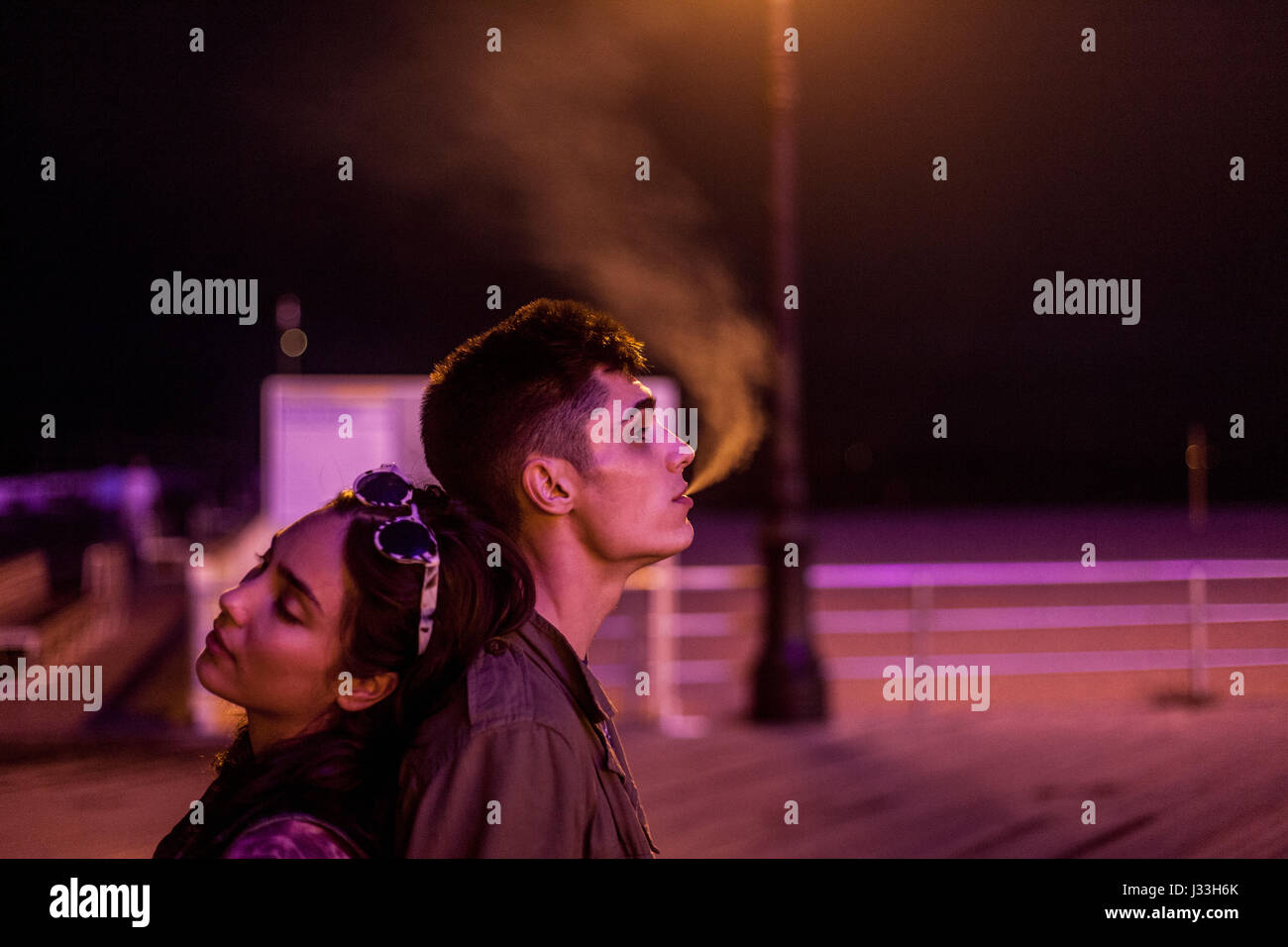 Young couple smoking Stock Photo - Alamy