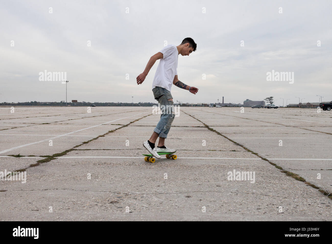 Young man skateboarding Stock Photo - Alamy