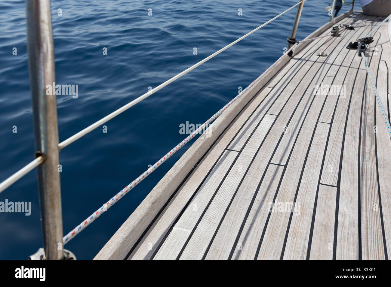 Saling yacht deck with sea on background Stock Photo - Alamy