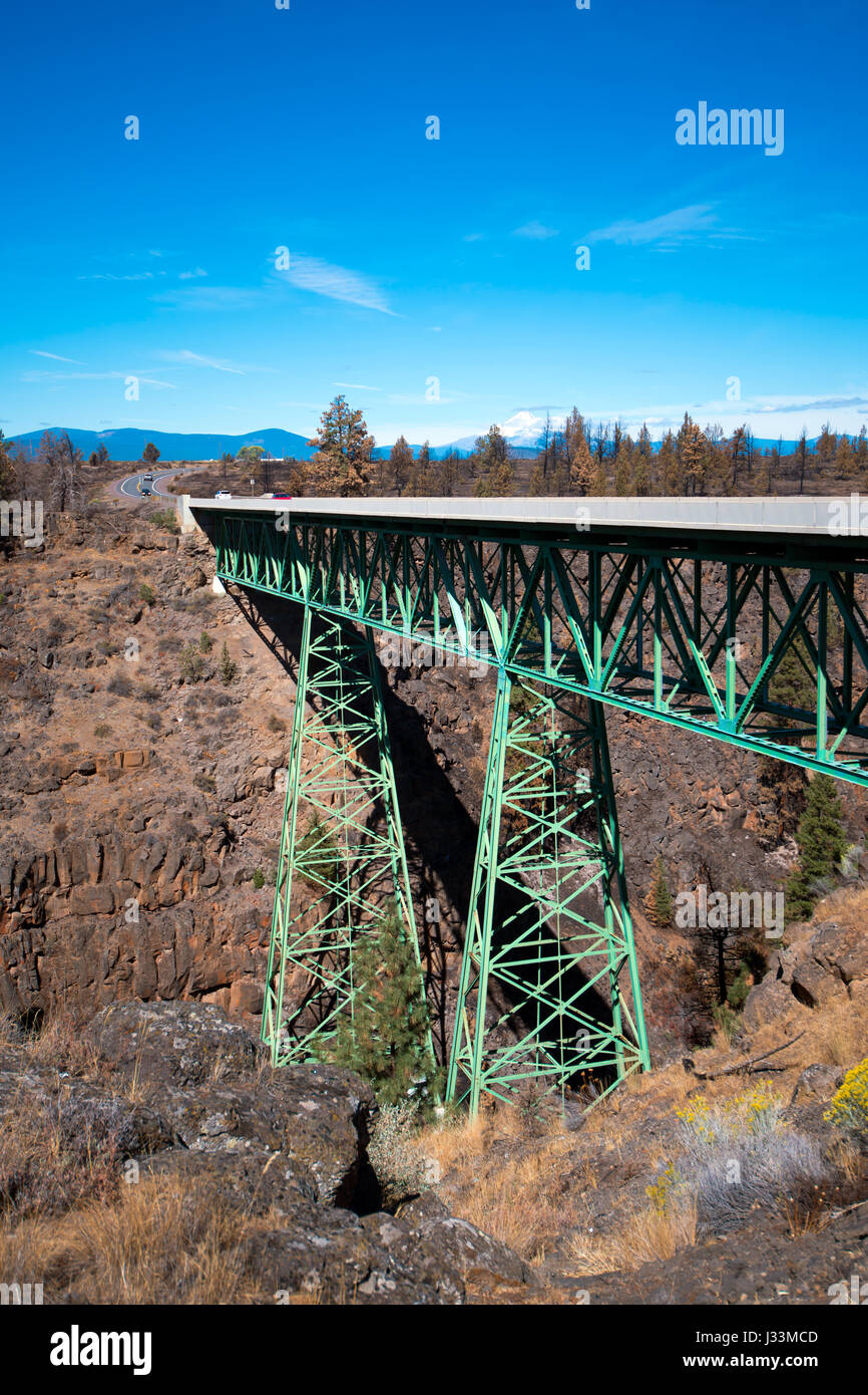 Smooth straight metal bridge constructed of triangular trusses and ...