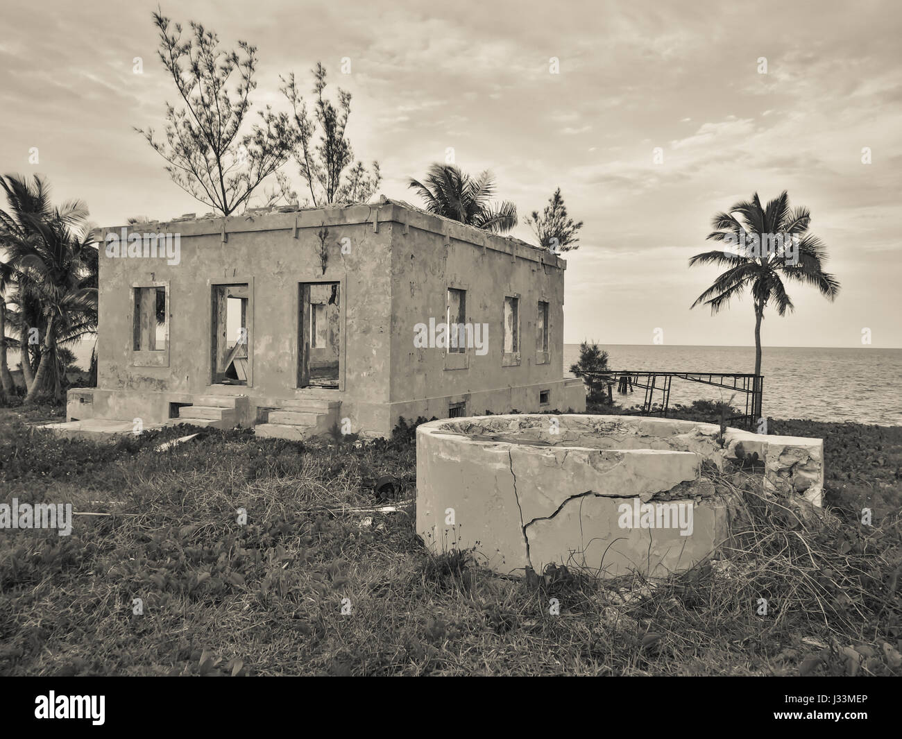 Abandoned lighthouse keeper house and well, in Gun Cay, in Bahamas ...