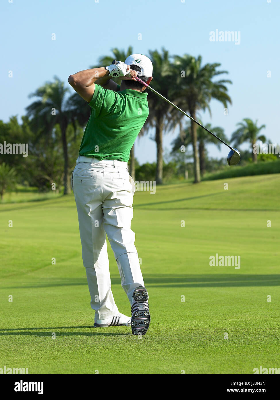 Rear view teeing off golf hi-res stock photography and images - Alamy