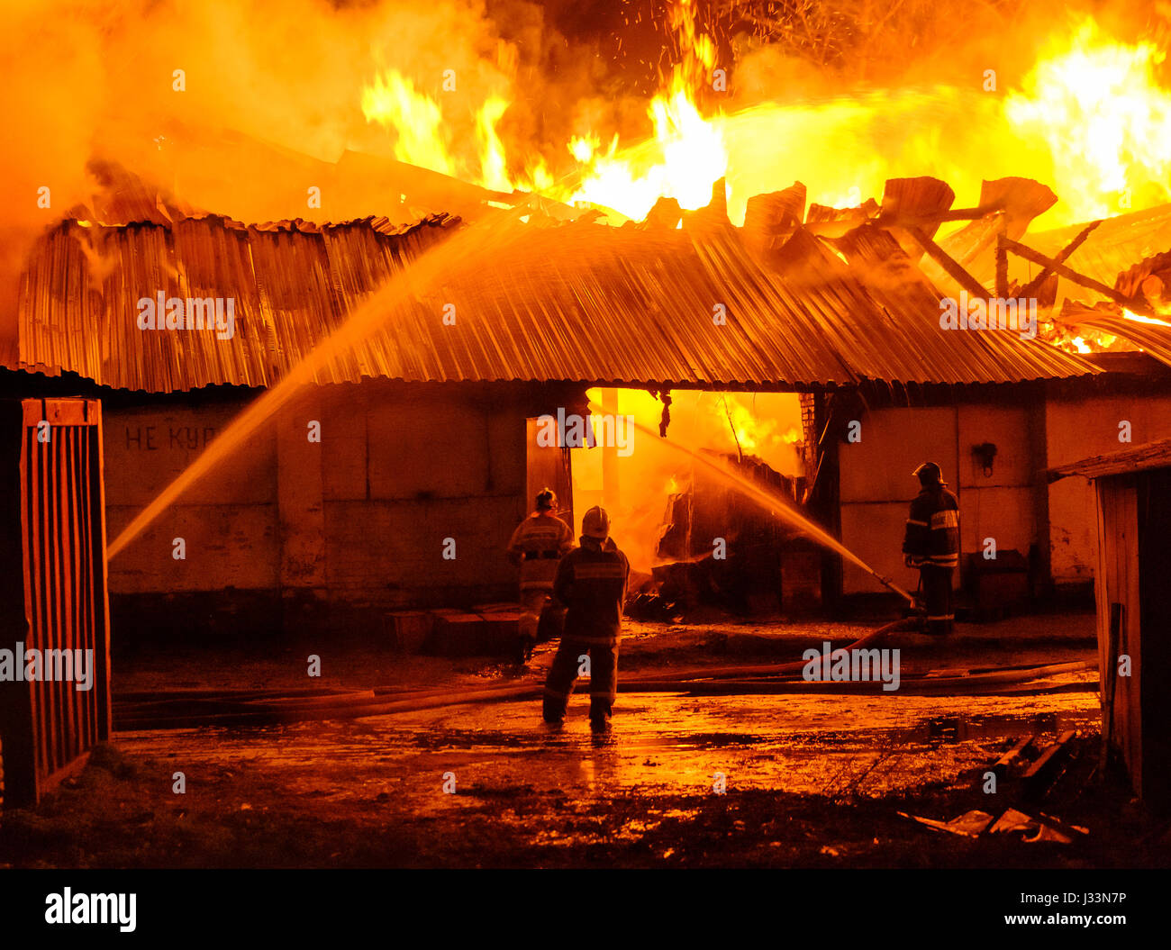 Firefighters extinguish a fire Stock Photo - Alamy