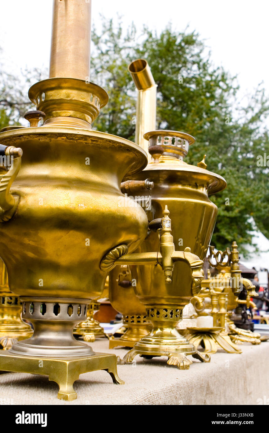 Vintage gold Russian samovars. Retro household items Stock Photo - Alamy