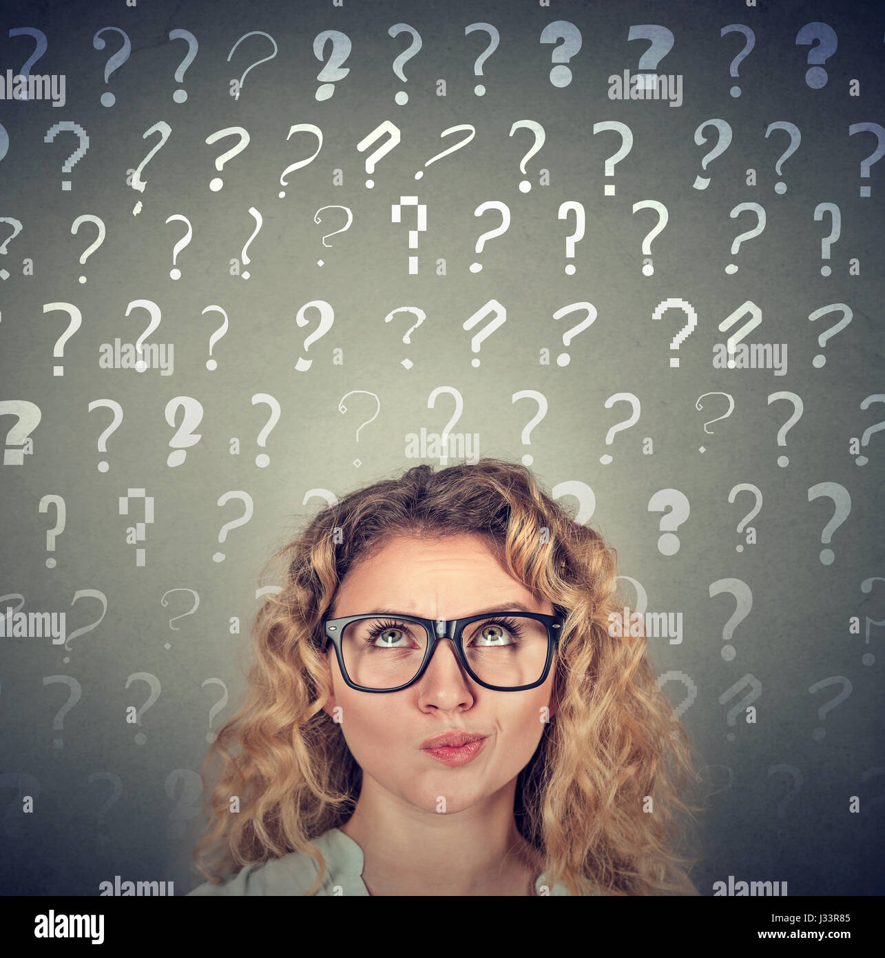 Woman thinking question marks hi-res stock photography and images - Alamy
