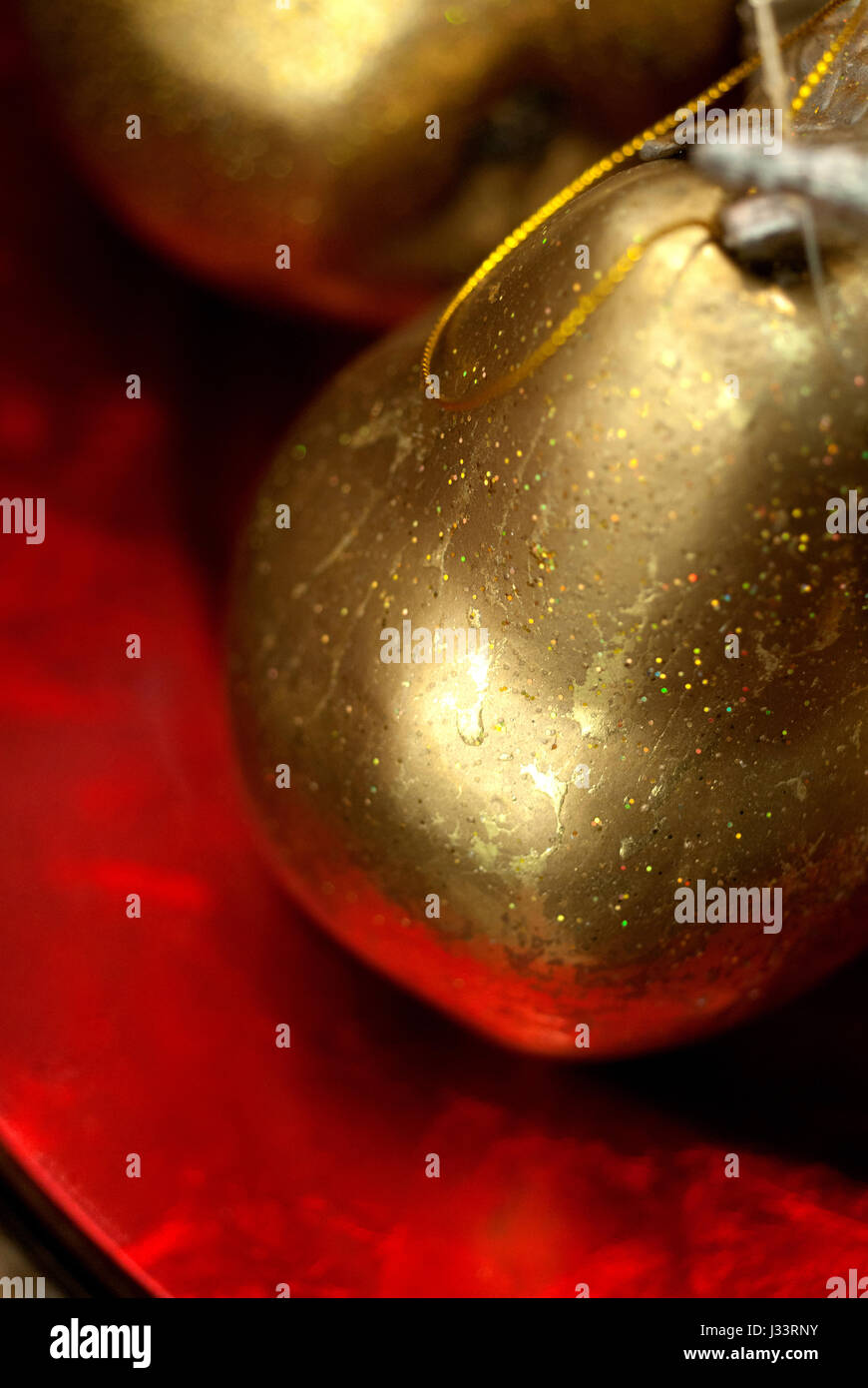 Gold painted pear / Decoration Stock Photo - Alamy