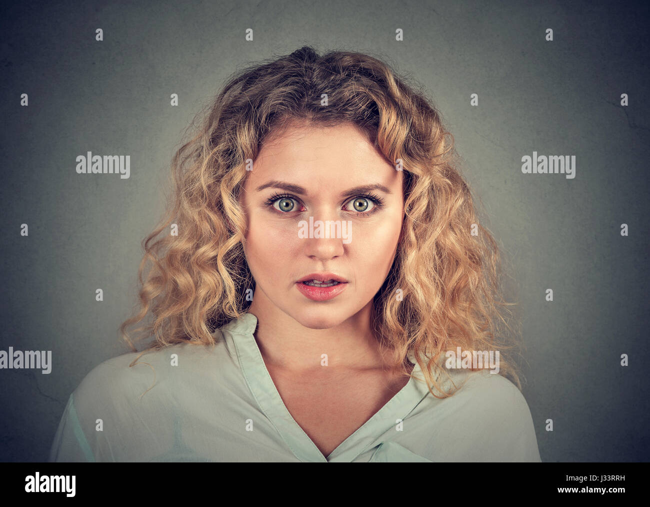 Concerned scared shocked woman Stock Photo - Alamy