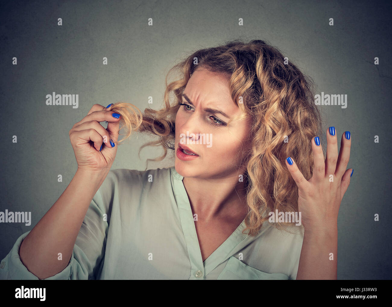 unhappy frustrated young woman surprised she is losing hair, receding ...