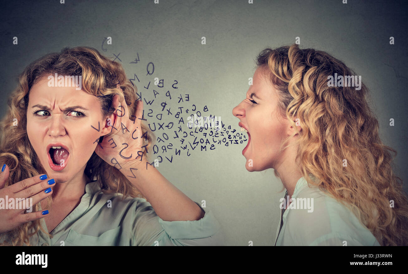 Split personality. Angry woman screaming at scared shocked herself ...