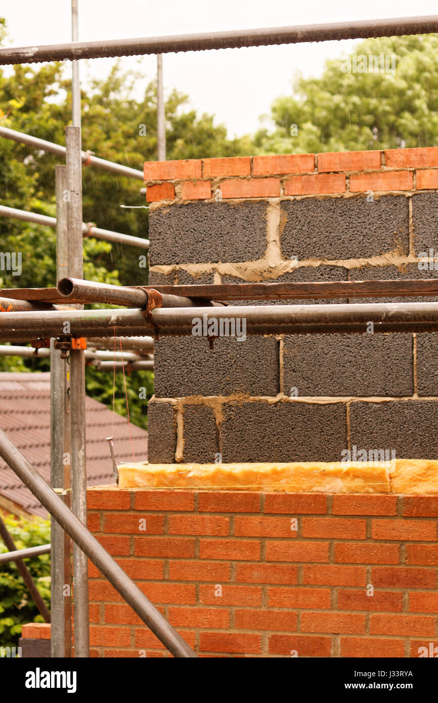 Scaffolding and brick wall Stock Photo - Alamy