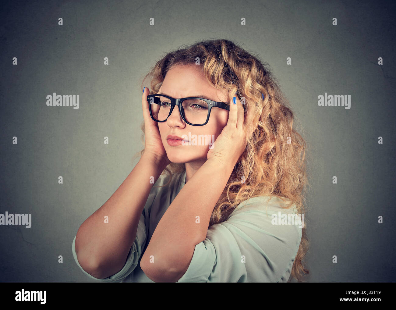 Sad woman with worried stressed face expression looking overwhelmed ...