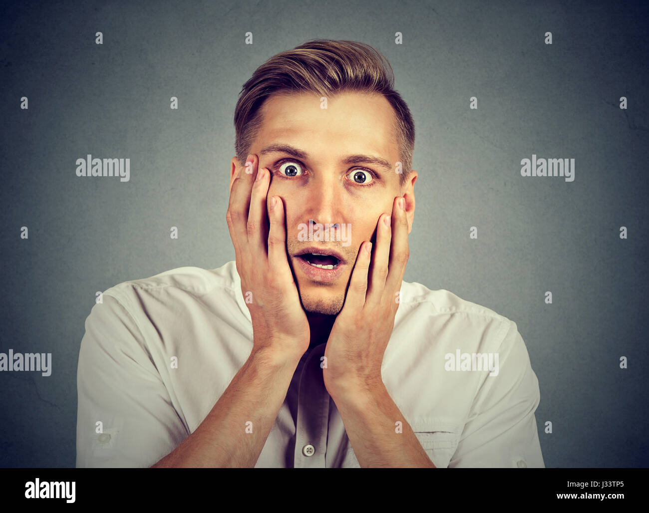 shocked young man with open mouth Stock Photo - Alamy