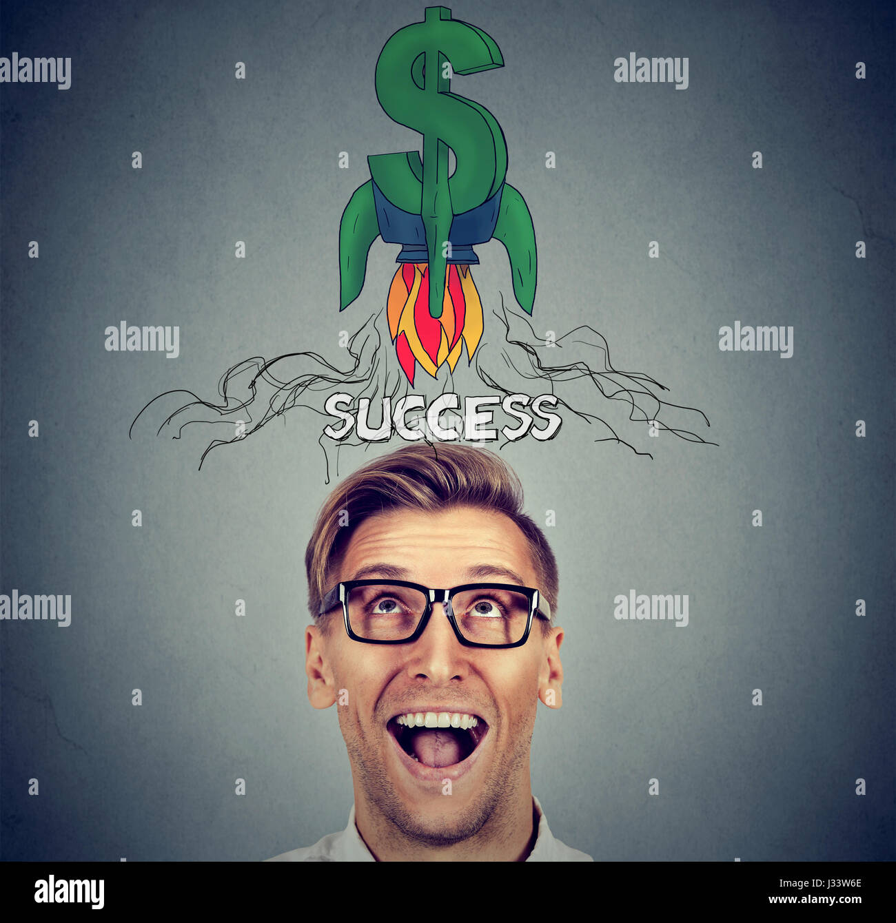 Financial business success concept. Surprised happy young man looking ... Financial business success concept. Surprised happy young man looking ...