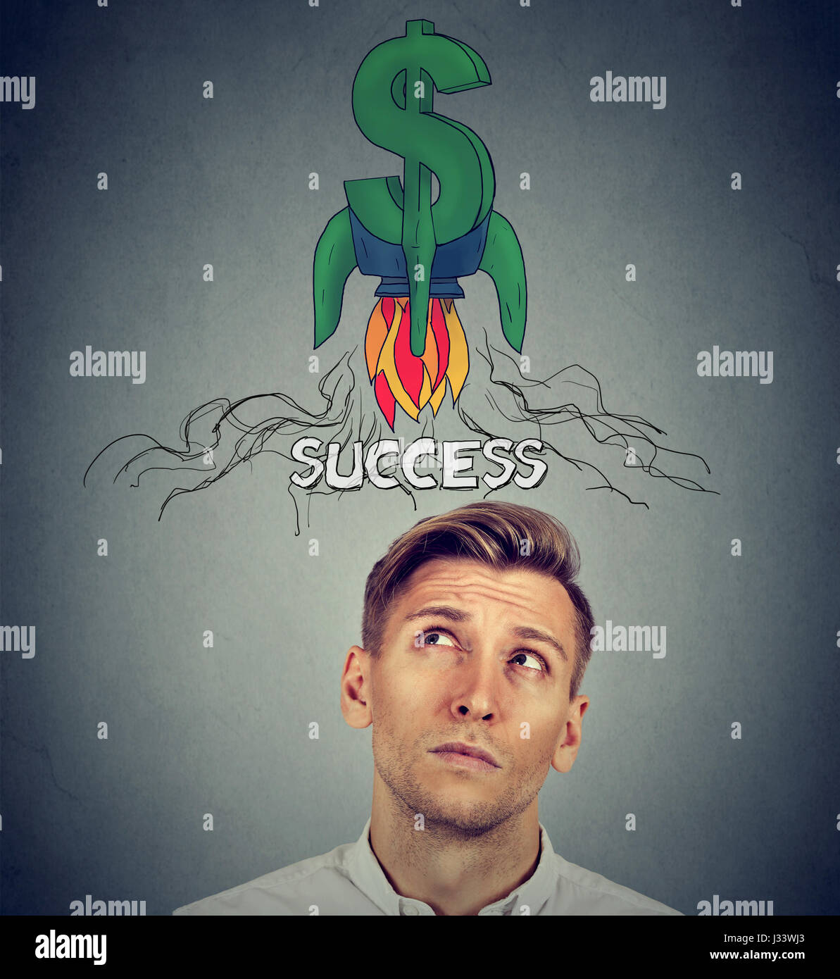 Financial business success concept. Thoughtful young man looking up at ...