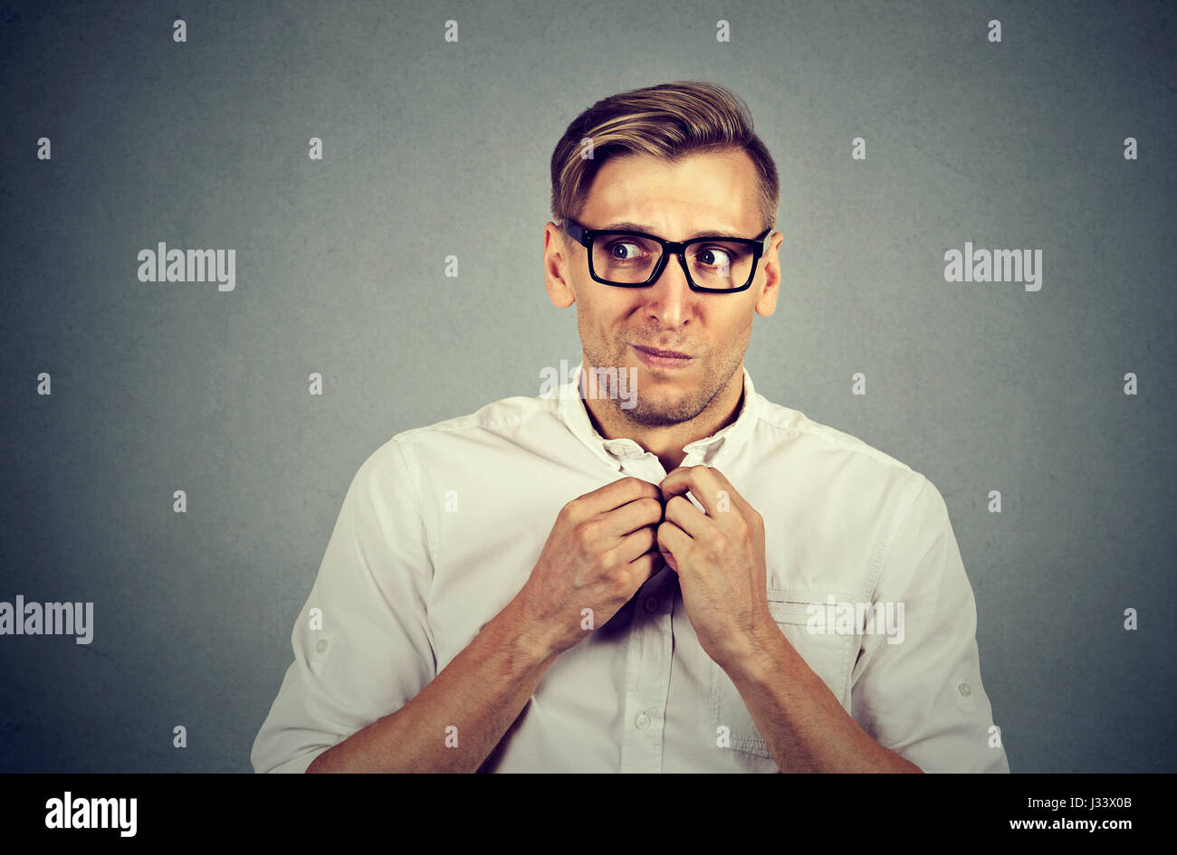 Nervous stressed young man student feels awkward looking away sideway ...