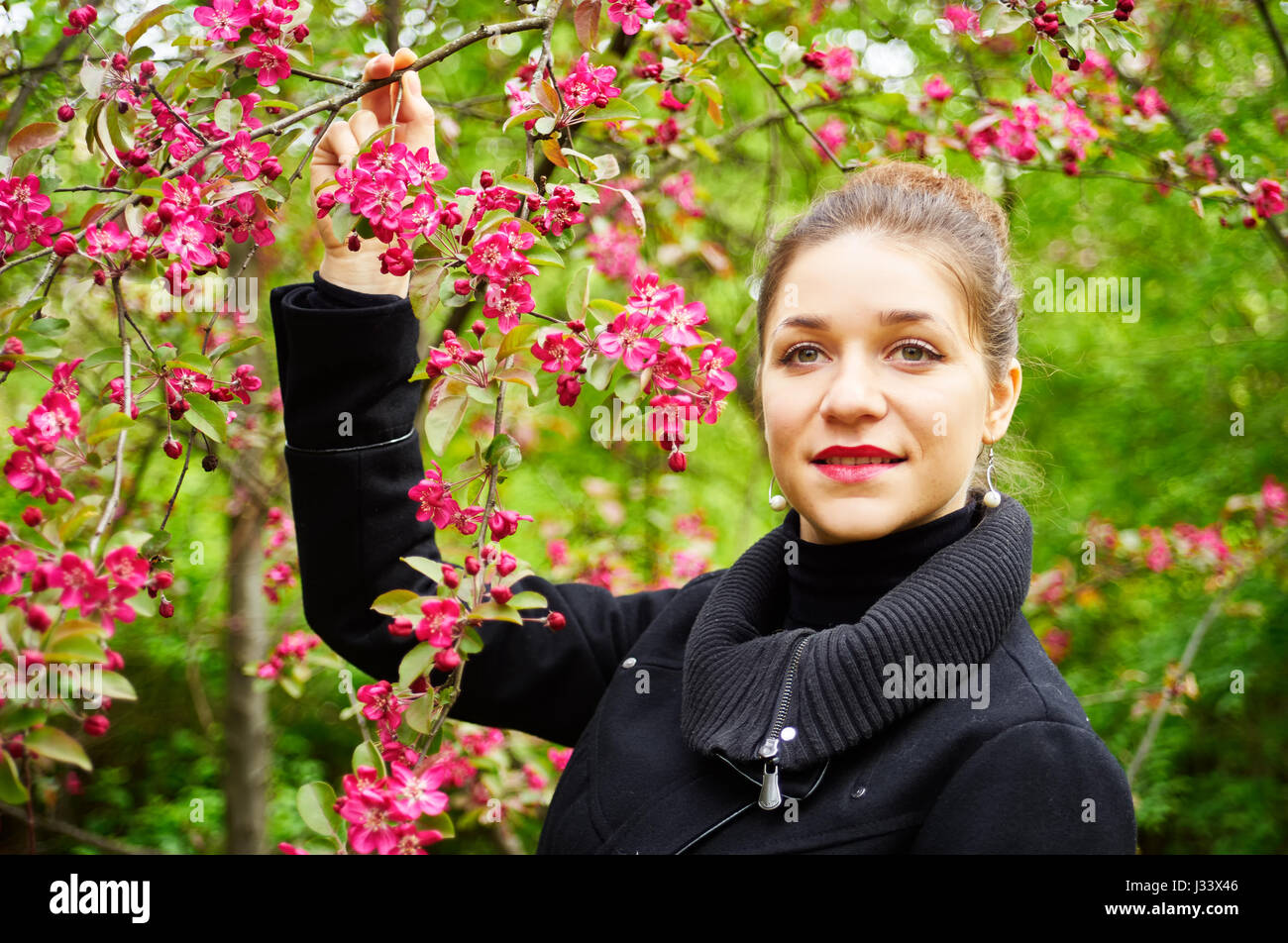 A female portrait with spring blossoming tree Stock Photo - Alamy