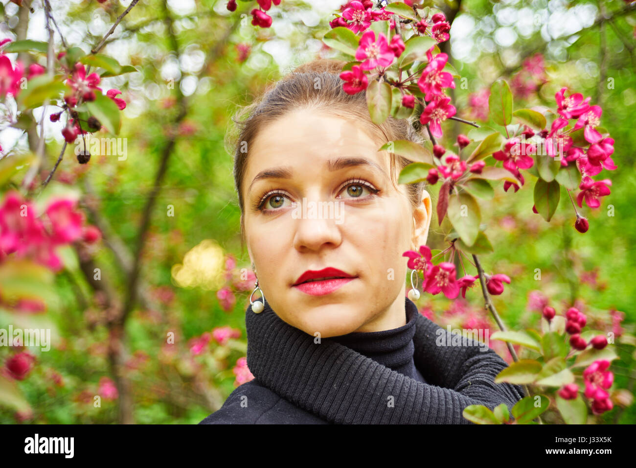 A female portrait with spring blossoming tree Stock Photo - Alamy