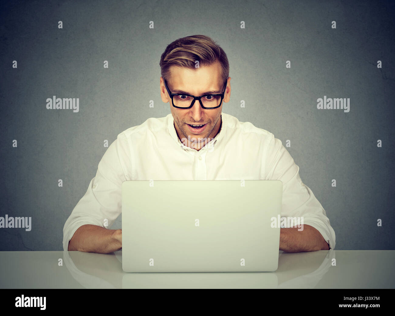 Nerd man using laptop look hi-res stock photography and images - Alamy