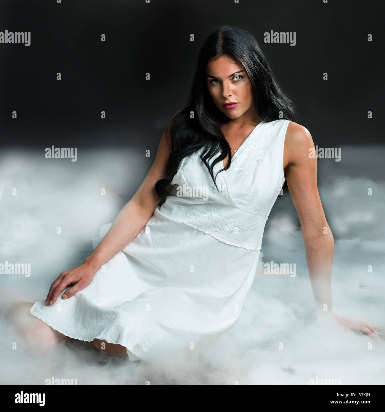Poppy Haskell modelling in fog Stock Photo - Alamy