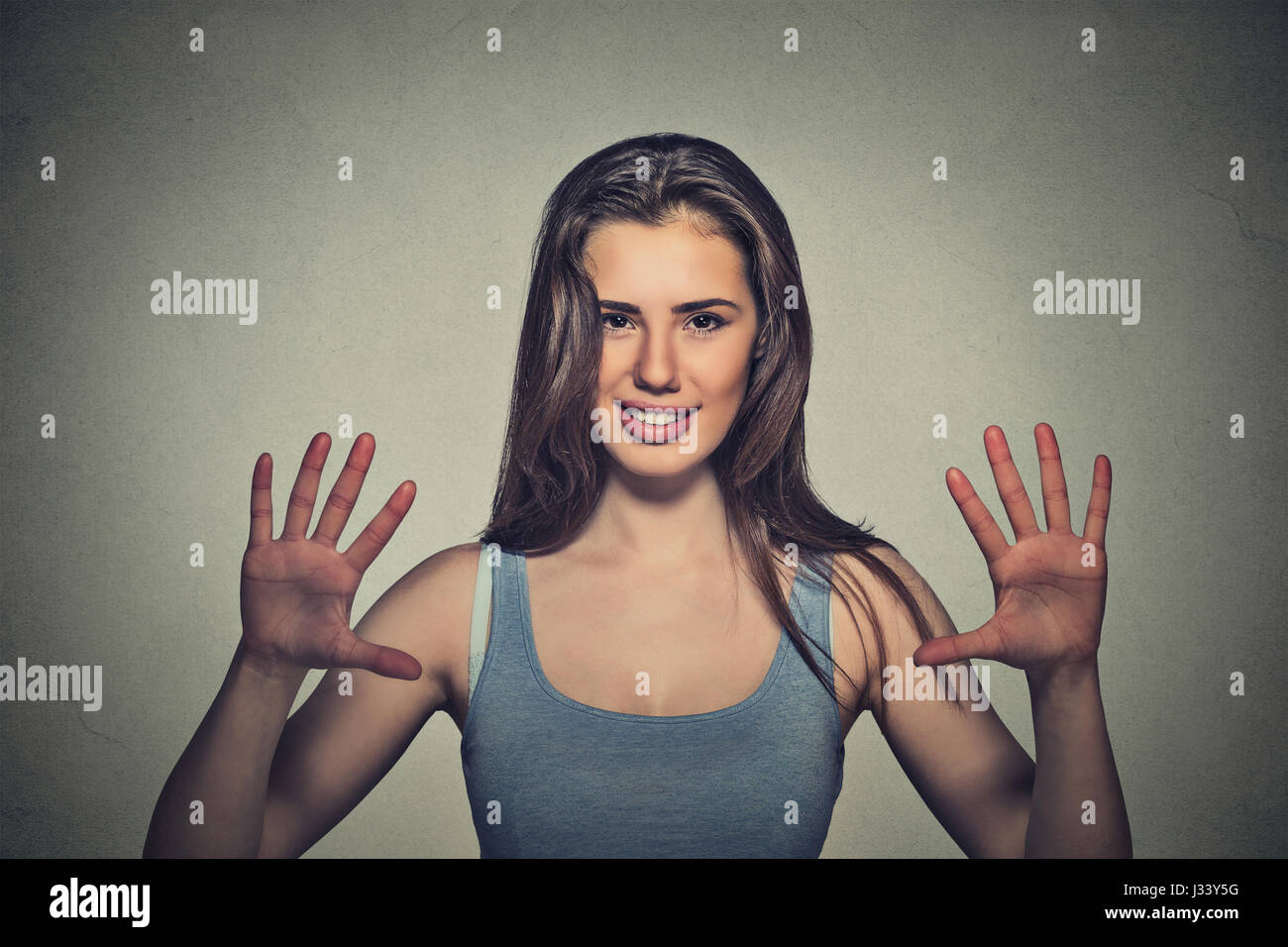 Closeup portrait, headshot happy, smiling young woman making five times ...