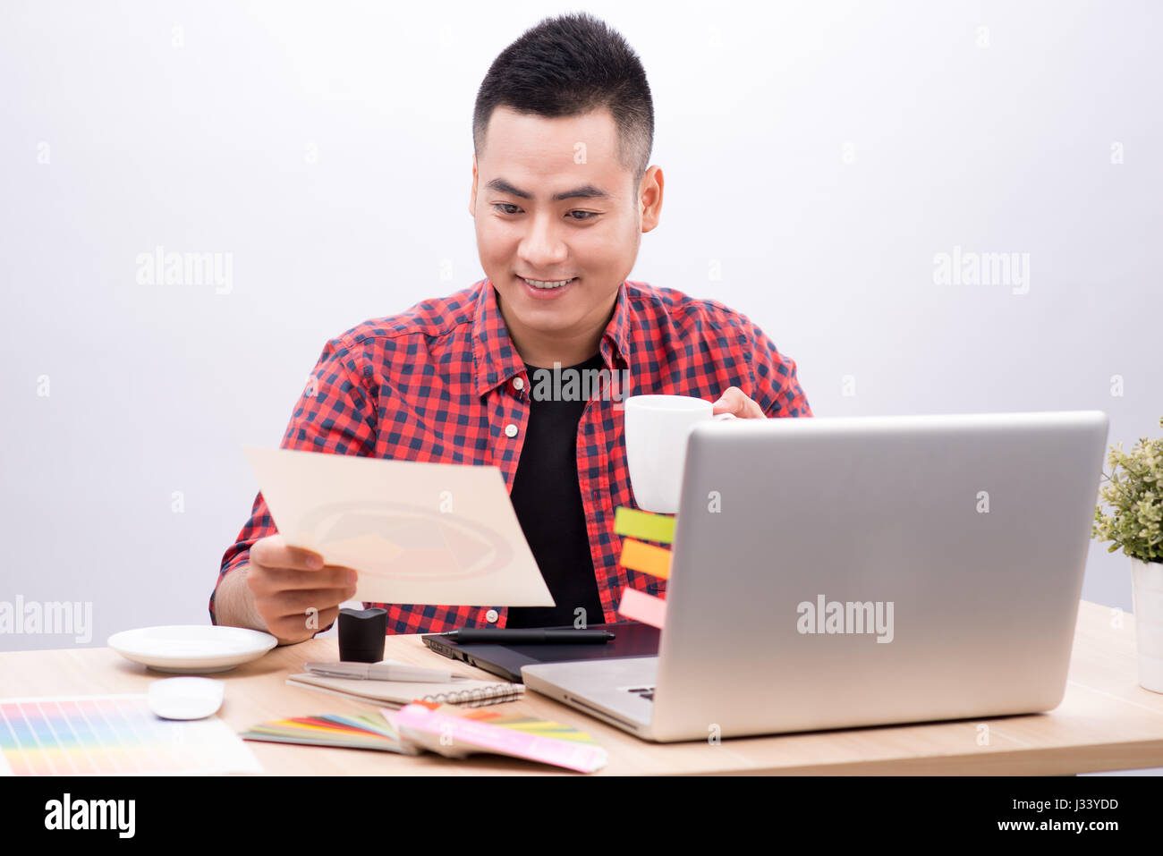 Happy designer hi-res stock photography and images - Alamy