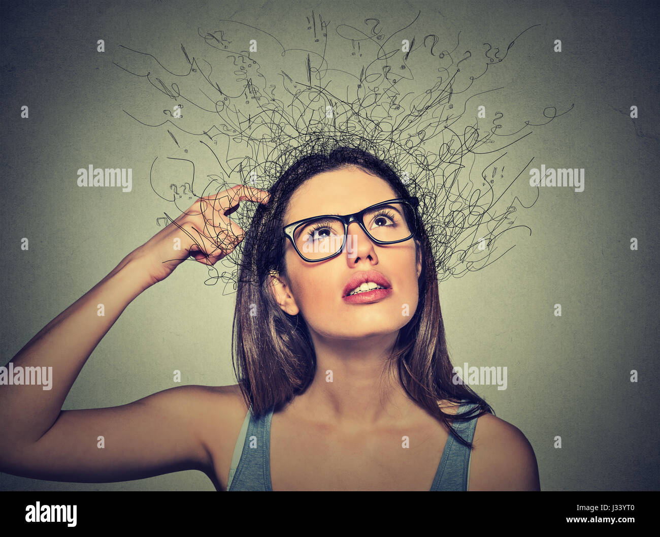 Closeup portrait young woman scratching head, thinking daydreaming with ...